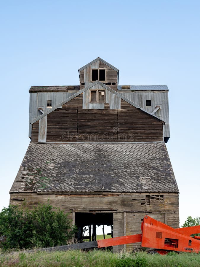 Unique Unusual Barn with Orange Implement in a Field Stock Image ...