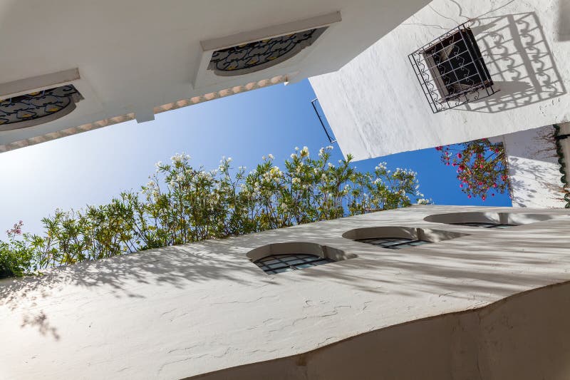 Unique Upward Perspective of Whitewashed Buildings with Decorative ...