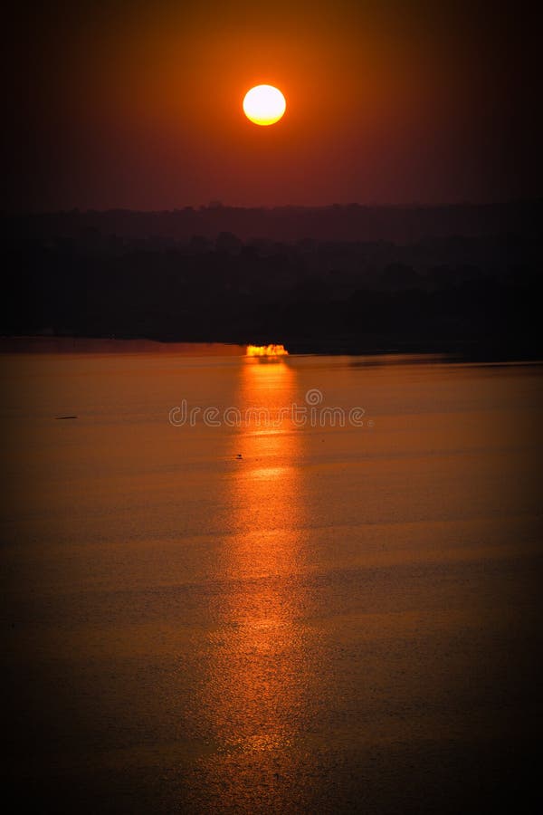A Unique View of the Sunset in Which the Rays of the Sun are Falling on ...