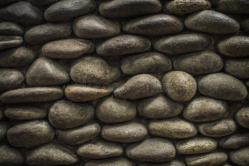 A Unique Wall Texture Using Natural Rounded Stone. Stock Image - Image ...