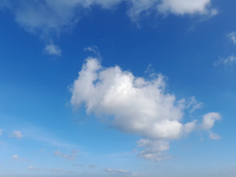 Unique White Clouds with a Bright Blue Sky Background Stock Photo ...
