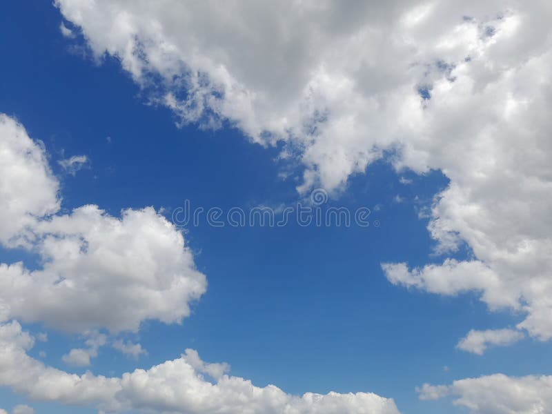 Unique White Clouds with a Bright Blue Sky Background Stock Photo ...