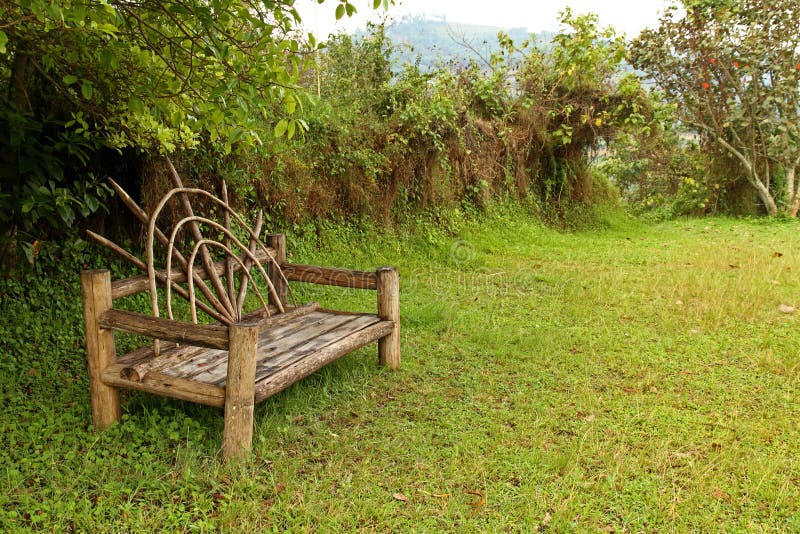 Unique Wooden Bench in a Meadow Stock Photo - Image of green, bench ...