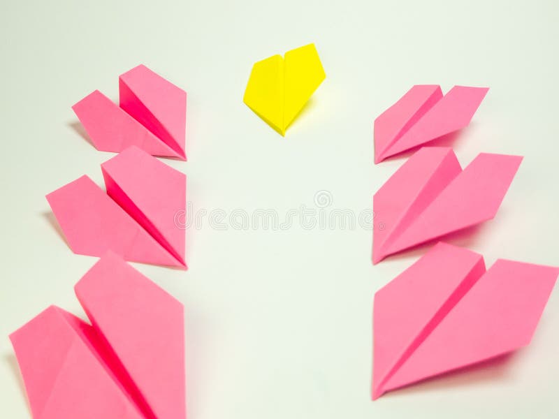 Unique Yellow Paper Airplane Surrounded by Pink Paper Airplanes Stock ...