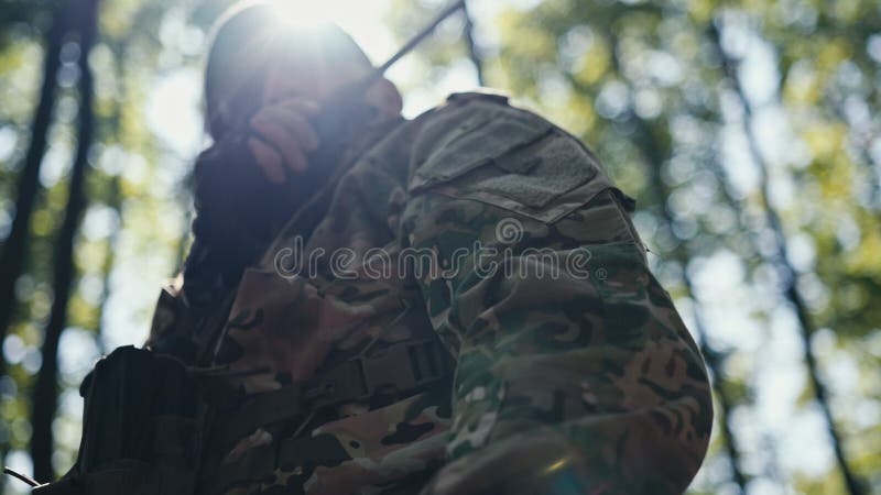 Military Officer while Talking on the Walkie Talkie in the Forest Stock ...