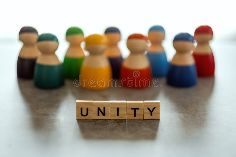 UNITY Word On Wooden Blocks With A Group Of People Stock Image - Image ...