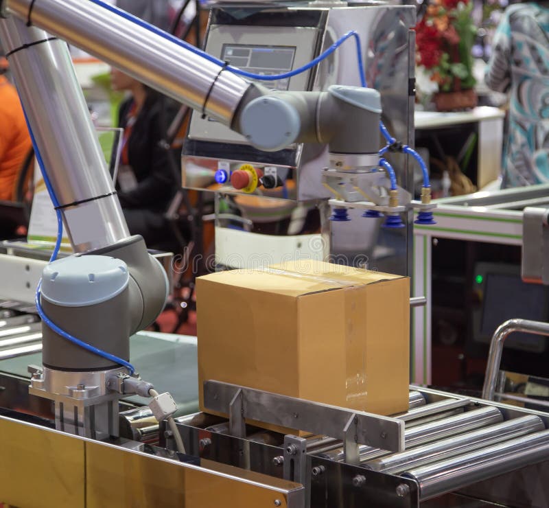 Robot, Lifting Heavy Pallet of Goods and Placing it on Conveyor Belt ...