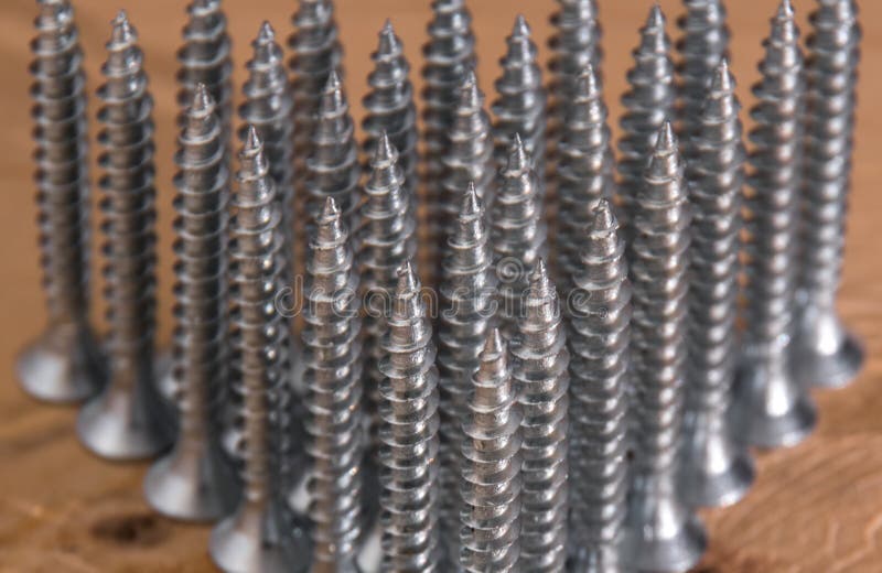 Universal Silver Screws with a Triangle Pointing Upwards Stock Photo ...
