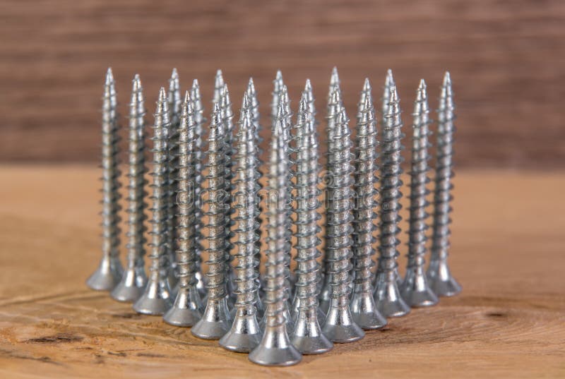 Universal Silver Screws with a Triangle Pointing Upwards Stock Image ...