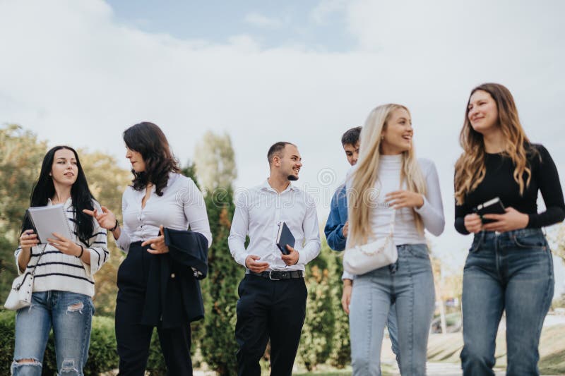 Students Collaborating Outdoors for Academic Success Stock Photo ...
