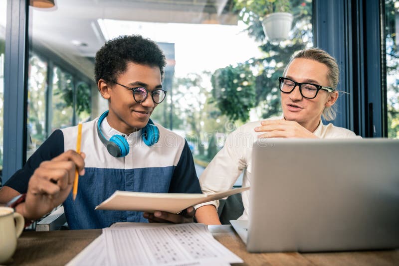 Joyful Positive Man Holding His Notebook in the Hand Stock Image ...