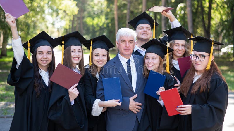 University Professor and Seven Graduates Rejoice at Graduation. Stock ...