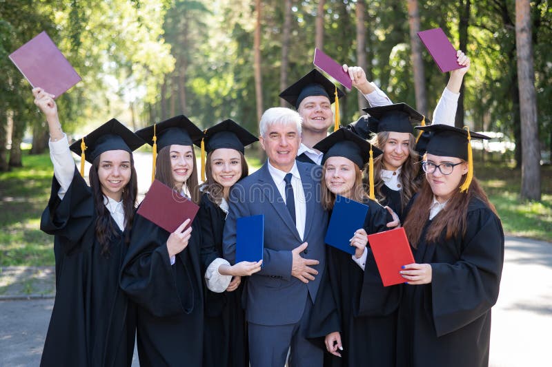 University Professor and Seven Graduates Rejoice at Graduation. Stock ...