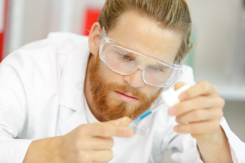 University Student Doing Experiment in Laboratory Stock Photo - Image ...