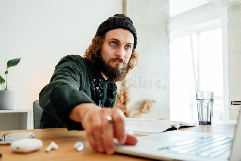 University Student Doing Home Work while Going Online Education Using ...