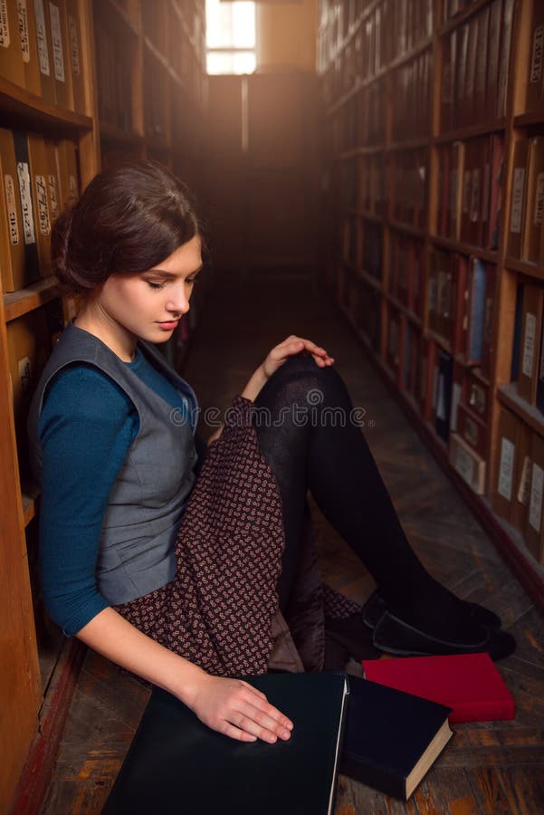 University Student Sitting on a Floor of Library. Stock Image - Image ...