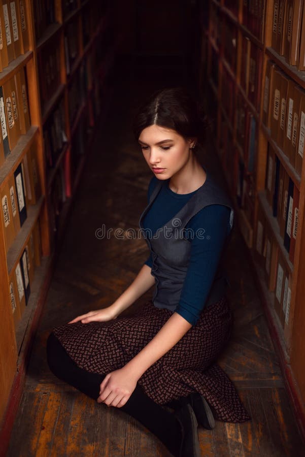 University Student Sitting on a Floor of Library. Stock Image - Image ...