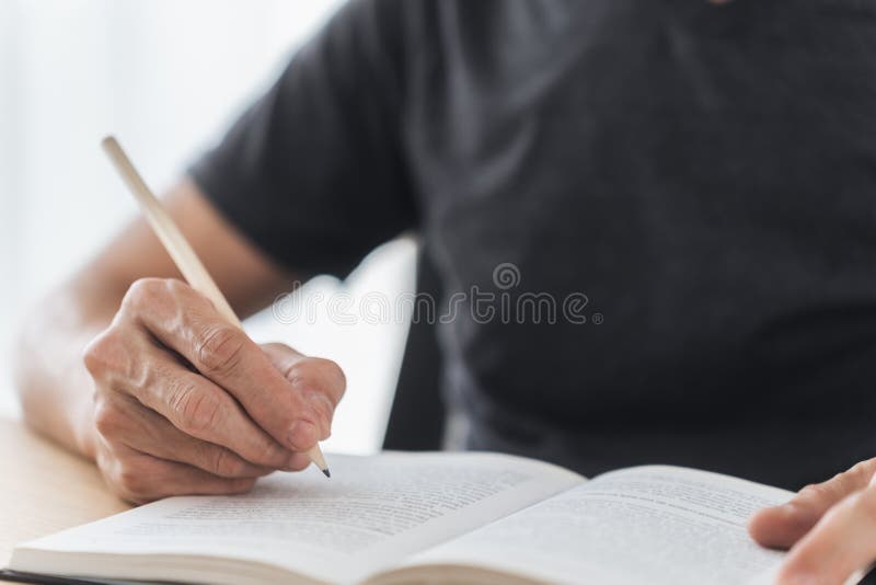 University Student Studying or Learning Book, Writing or Reading ...