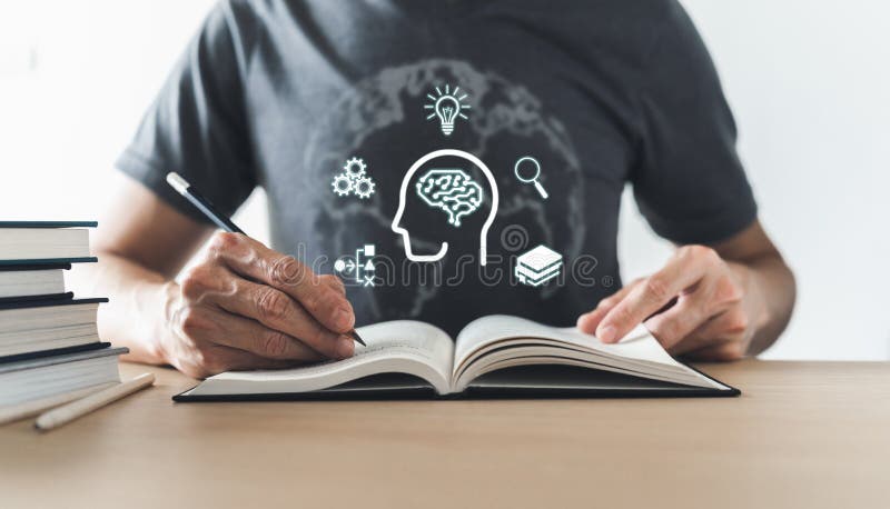 University Student Studying, Writing and Reading Book or Textbook with ...