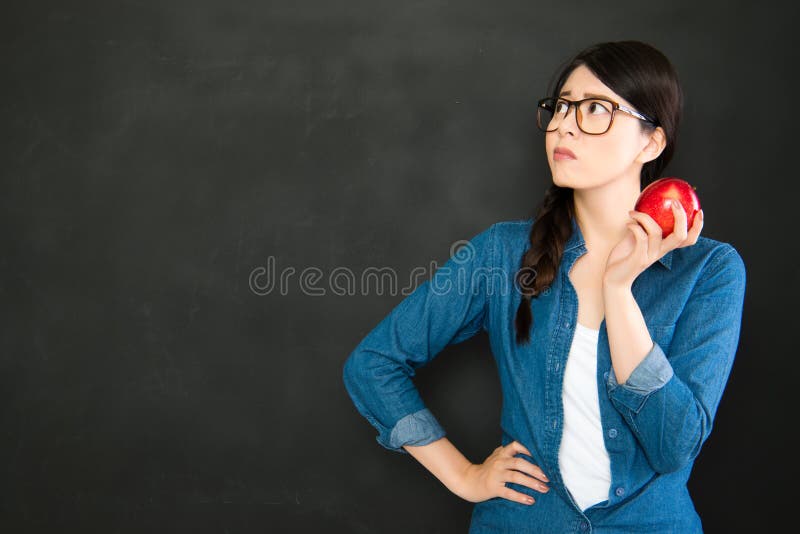 University Student Thinking Question in Front of Blackboard with Stock ...