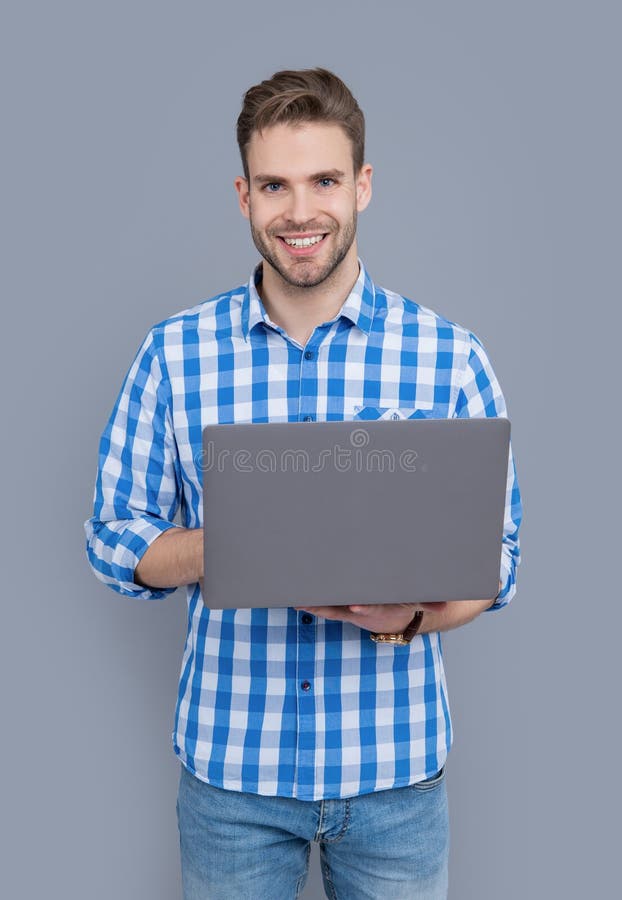 University Student Using Laptop for Studying Online. Happy Man Typing ...