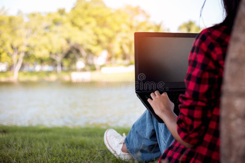 University Student Using Laptop Under Tree. Education Concept Stock ...