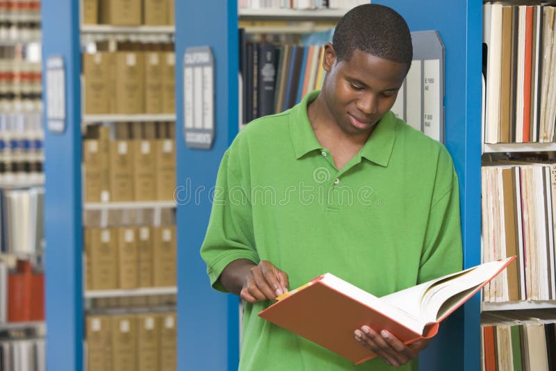 University Student Selecting Book in Library Stock Photo - Image of ...