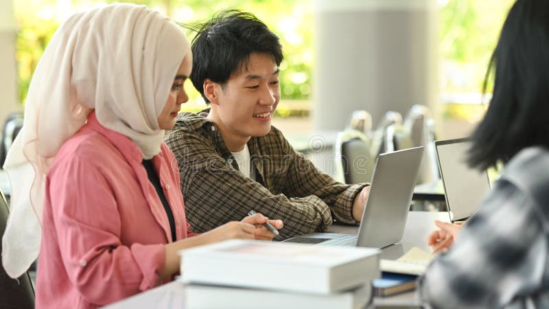 University Students Collaborating on a Project in Campus. Education ...