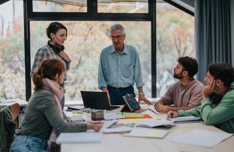 University Students Collaborating with Senior Professor for Project ...
