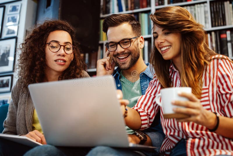 University Students in Cooperation at Library. Group of Young Friends ...