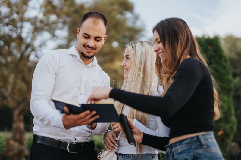 University Colleagues Collaborating and Learning in a Sunny Park Stock ...