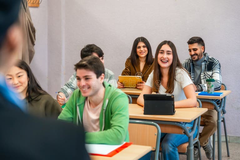 University Students Following a Lesson and Using Digital Tablets Stock ...