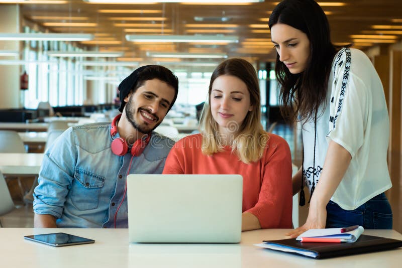 University Students Using Laptop in University Library Stock Photo ...