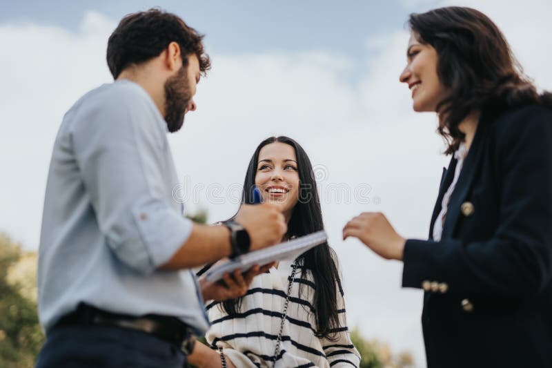 University Students Study and Discuss Subjects Outdoors, Preparing for ...