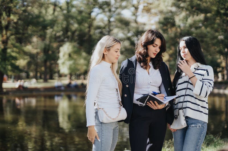 University Students Studying and Discussing Subject Topics in a Sunny ...