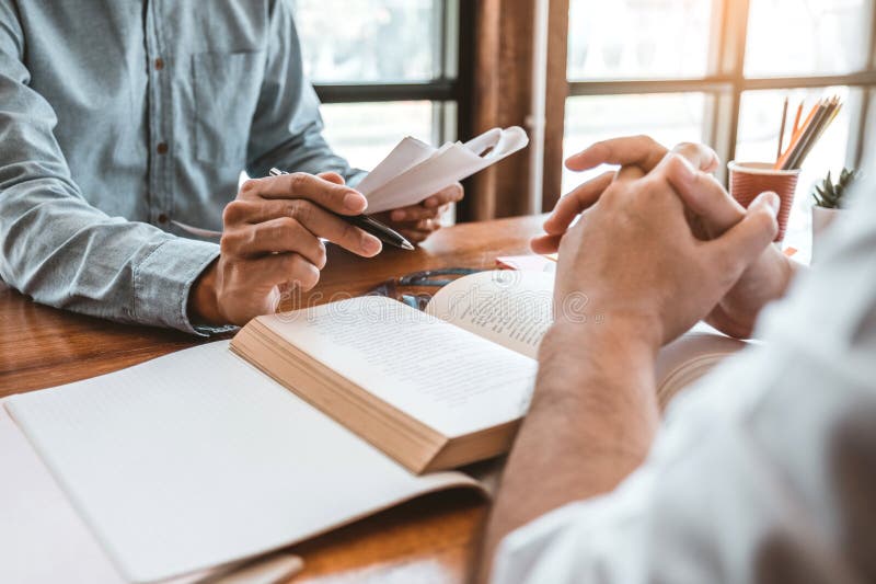 University Students Studying and Reading Together in Library Research ...