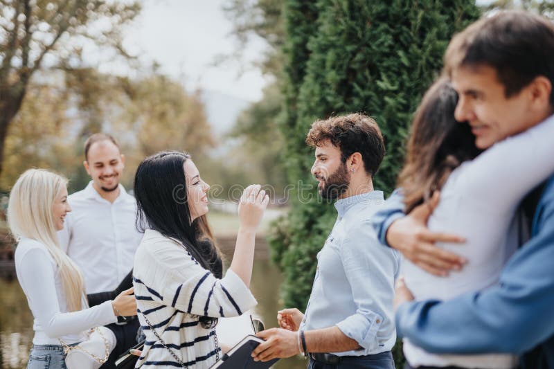 University Students Studying Together in a Sunny Park, Discussing ...