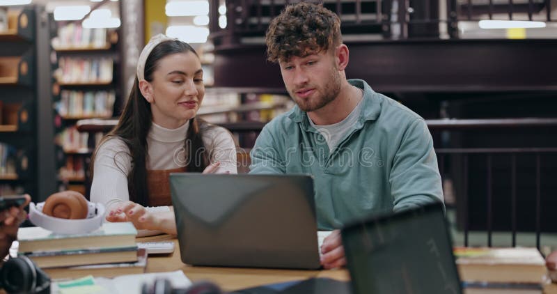University, Students and Talking with Laptop in Library To Explain ...