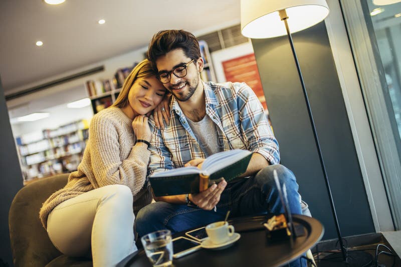 Students Talking while Learning in a Cafe Together Stock Photo - Image ...