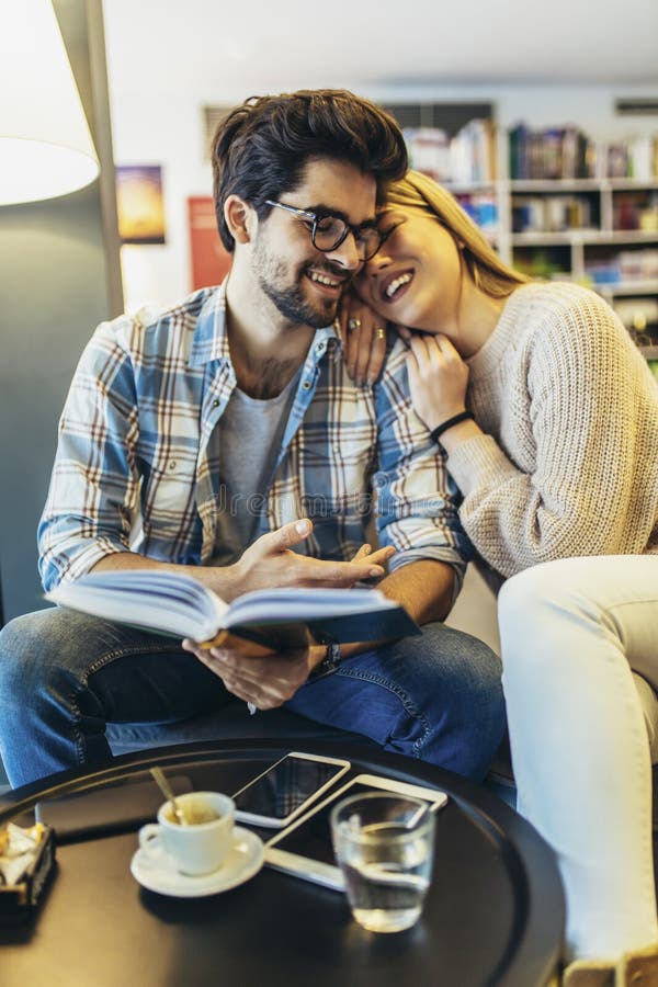Students Talking while Learning in a Cafe Together Stock Image - Image ...