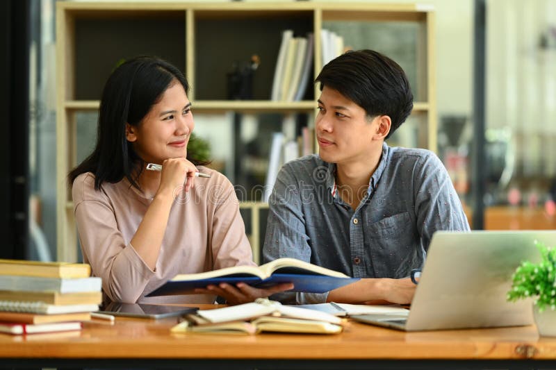University Students Using Laptop, Working Together on Academic Project. Education, Learning and ...