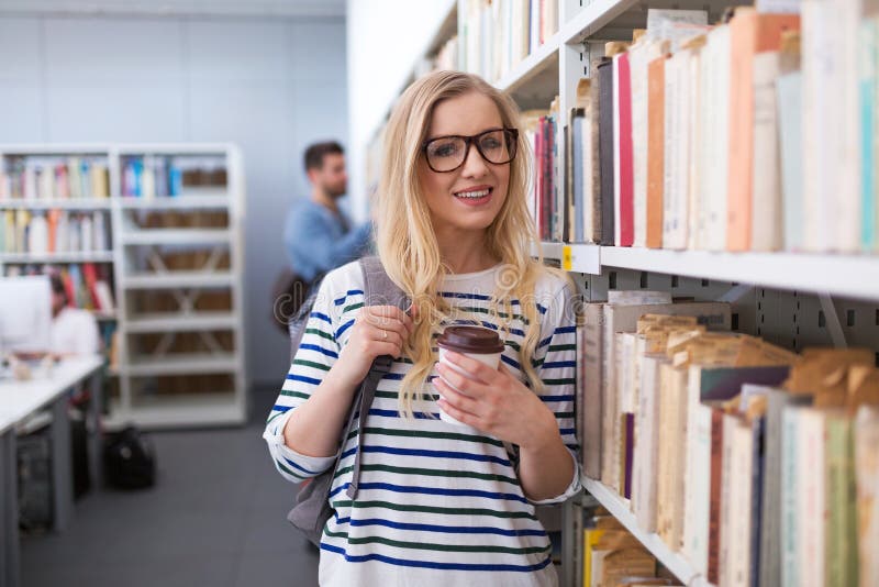 Students Working in the Library at Campus Stock Photo - Image of laptop ...