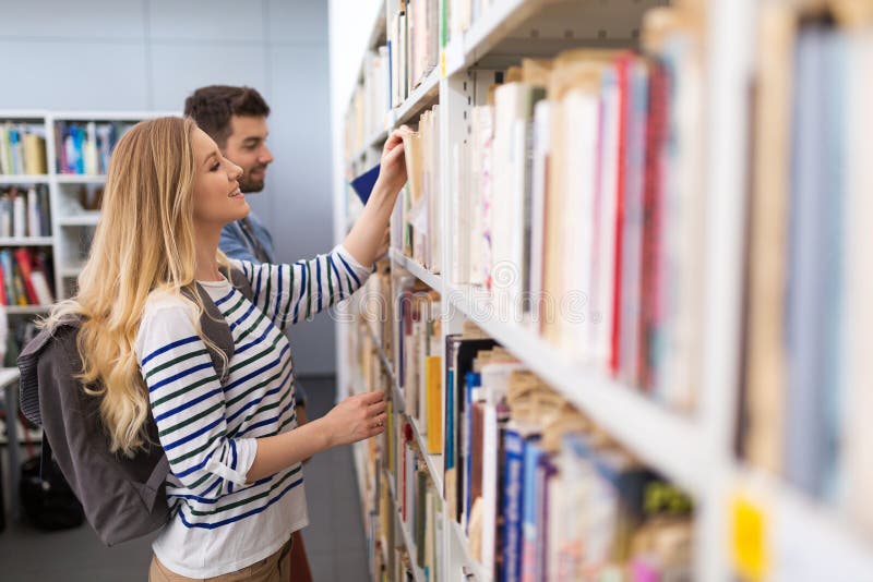 Students Working in the Library at Campus Stock Image - Image of laptop ...