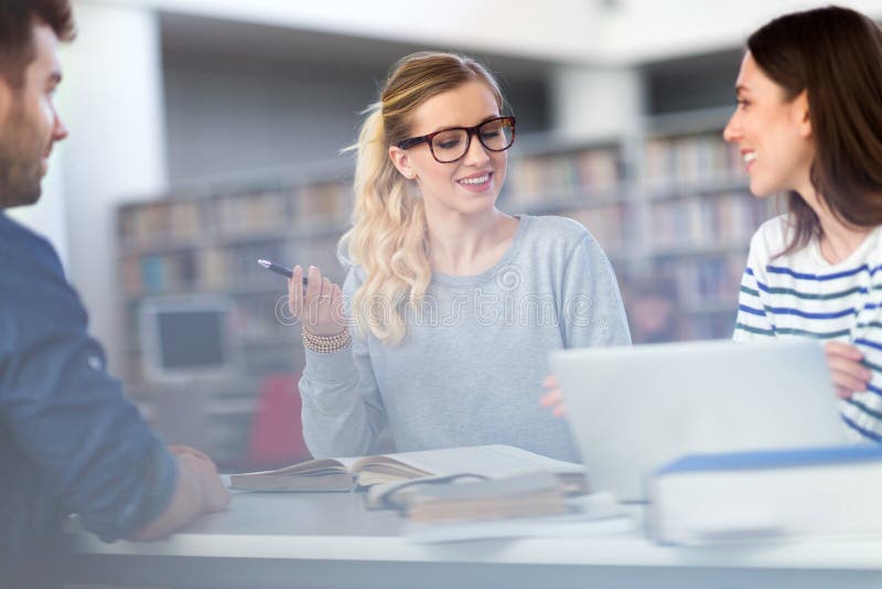Students Working in the Library at Campus Stock Image - Image of ...