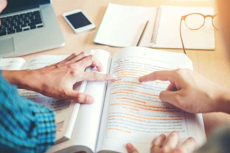 University Studying Friends Studying and Reading a Books in Classroom ...