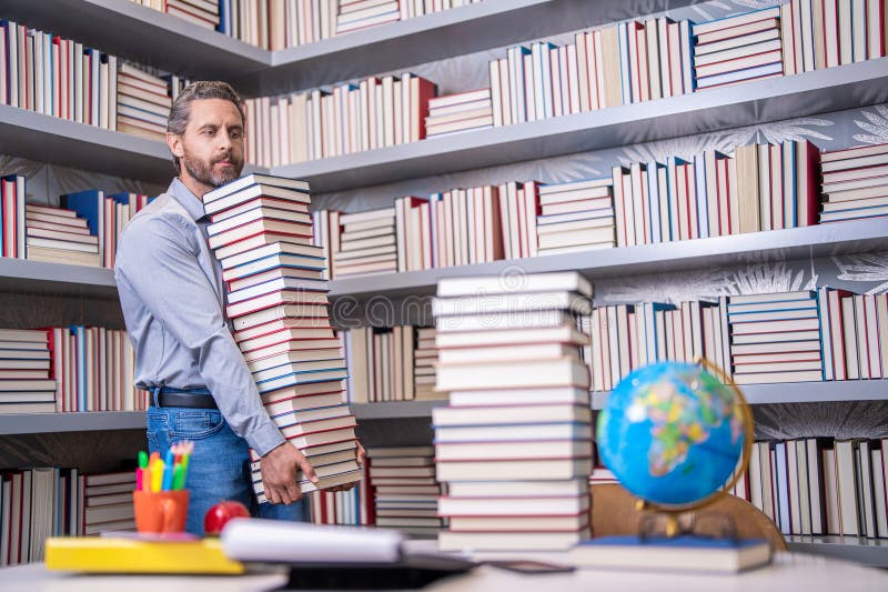 University Teacher Professor in School Classroom Library Preparing for ...