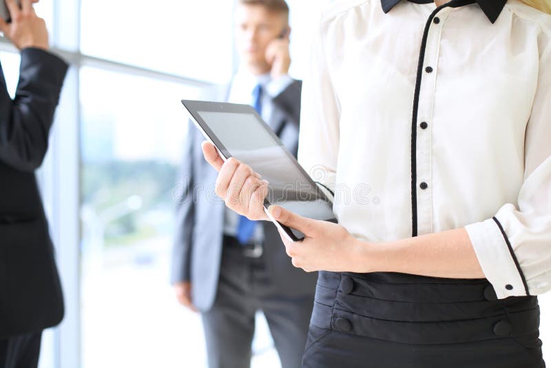 Unknown Business Woman Using Tablet Computer in Office Hall among ...