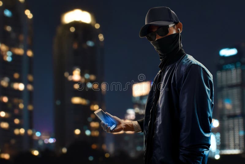 Hacker Holding Mobile Phone in Server Room Stock Image - Image of ...