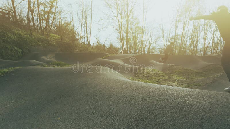 Unknown Kids and Adults Ride on Pumptrack or Pump Track at Sunset Stock ...