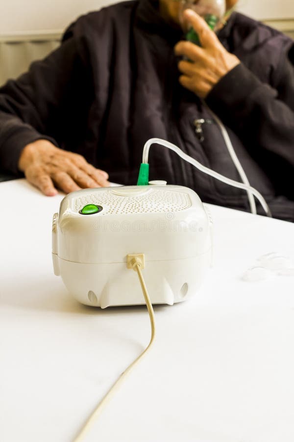 Unknown Older Person Using Home Type Mini Air Machine `nebulizator ...